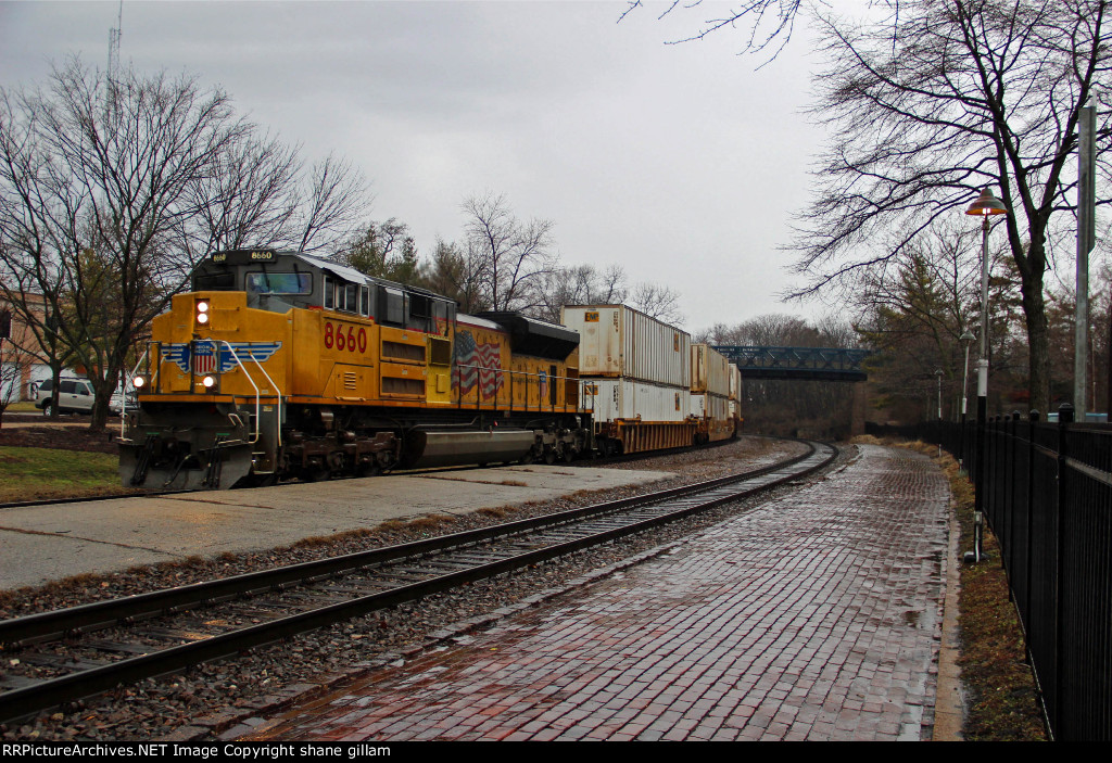 UP 8660 Takes a Eb stack train up the grade.